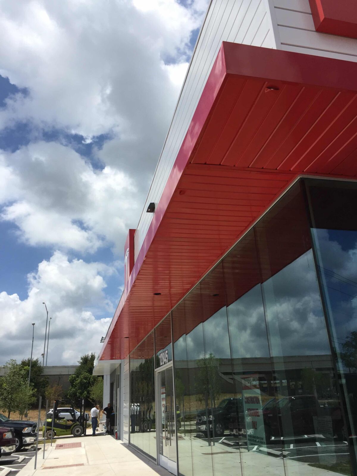 Custom cantilevered brow canopies - Tesla ATX - Austin American Awning