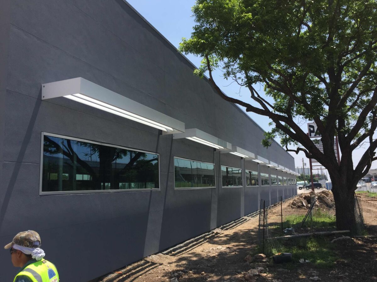 Custom cantilevered brow canopies - Tesla ATX - Austin American Awning