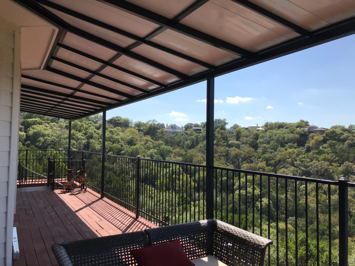 Wrap around standing seam patio cover - Austin American Awning