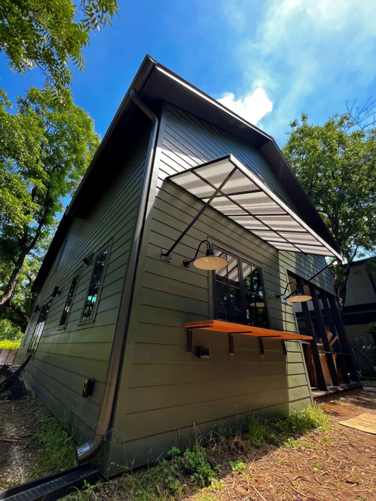 Striped flat panel over casement kitchen window - Austin American Awning